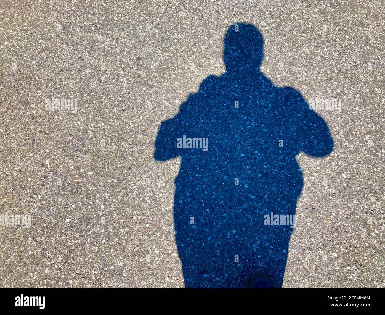 Shadow of obese man Stock Photo - Alamy