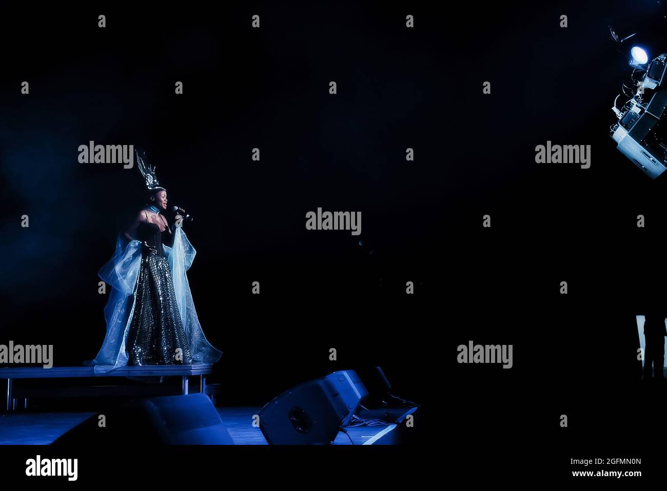 JOHANNESBURG, SOUTH AFRICA - Apr 24, 2019: singer on stage with blue ...
