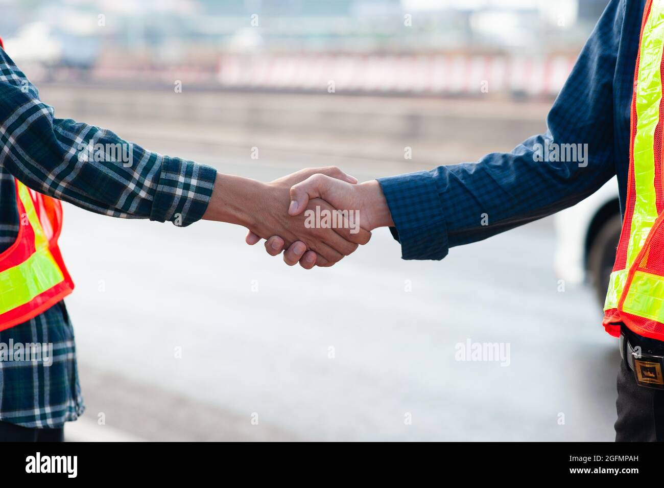 Closeup shake hand teamwork engineer on site work success , Hand shake ...