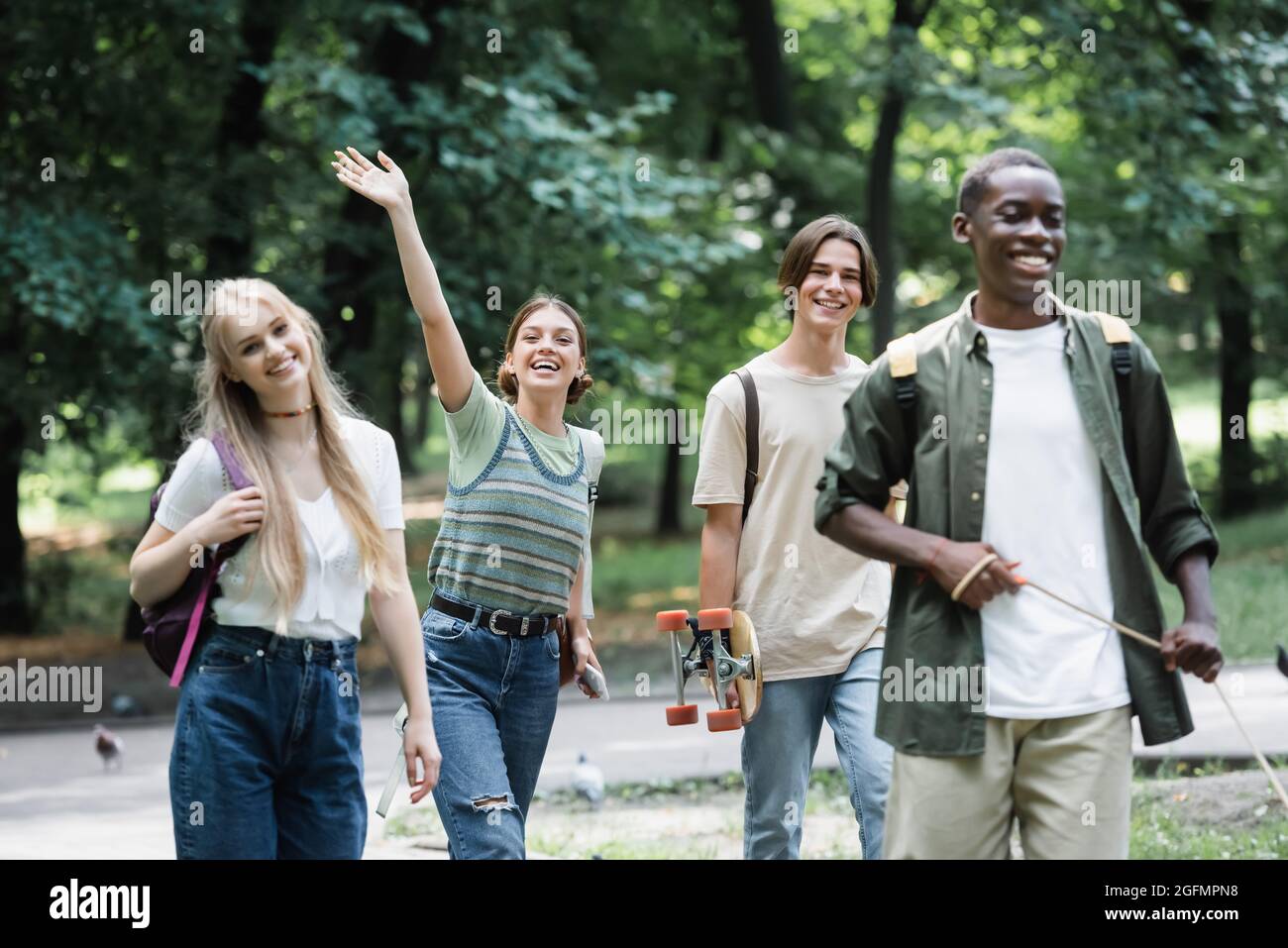 Teenager girls waving hello hi-res stock photography and images - Alamy