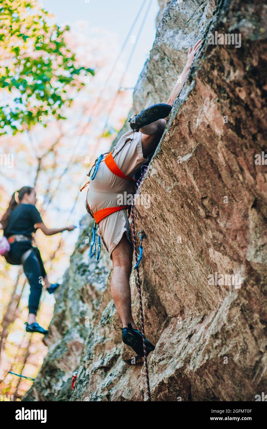 Two friends have been climbing on the rocks and fun to spend time Stock ...
