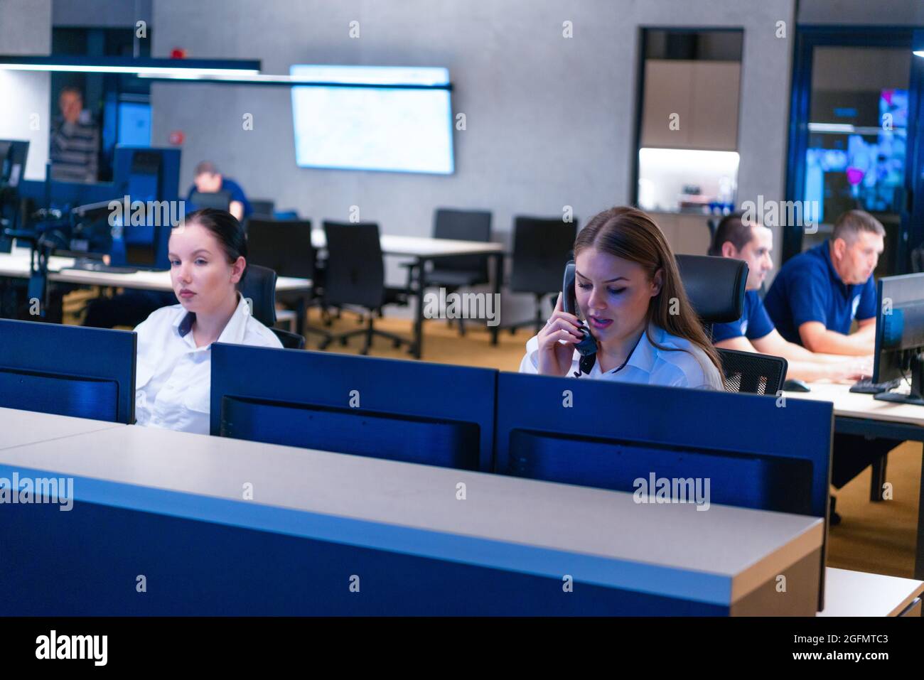 In the System Control Room, Technical Operator Works at His Workstation ...