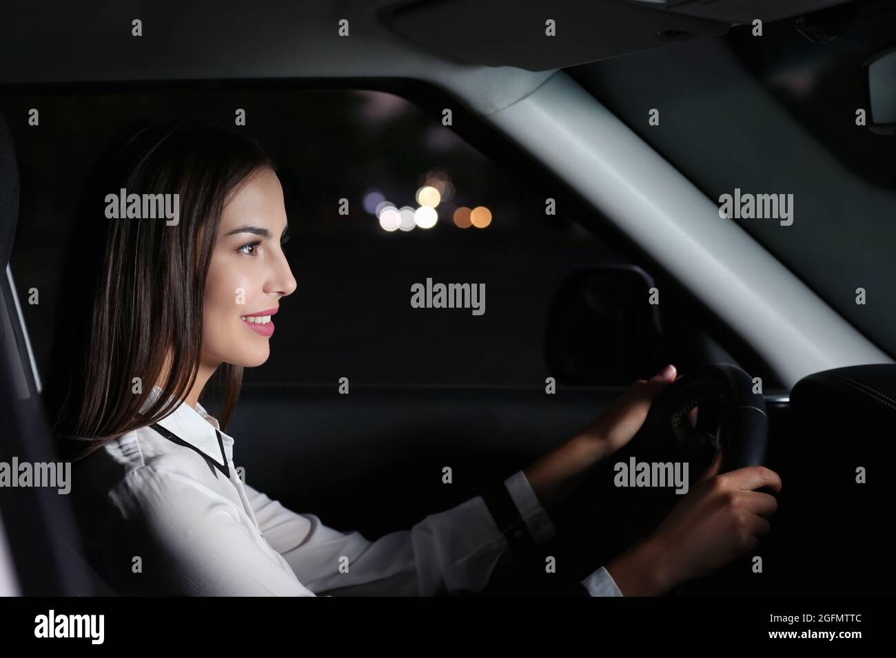 Beautiful girl driving a car Stock Photo - Alamy