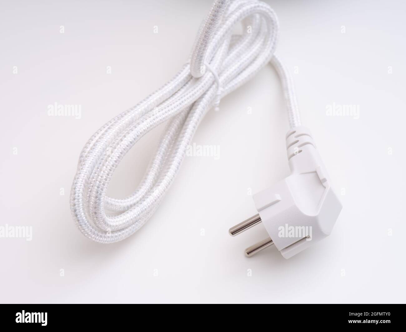 A tied up electric plug. Close up Stock Photo - Alamy