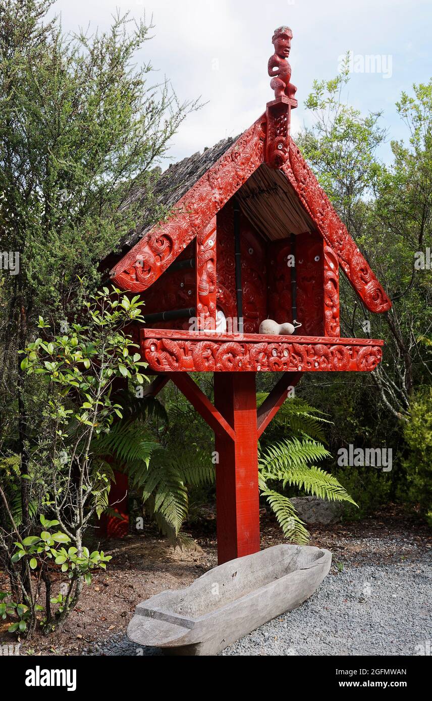 Pataka, pole mounted storage shelter, red, carved wood, male figure on ...