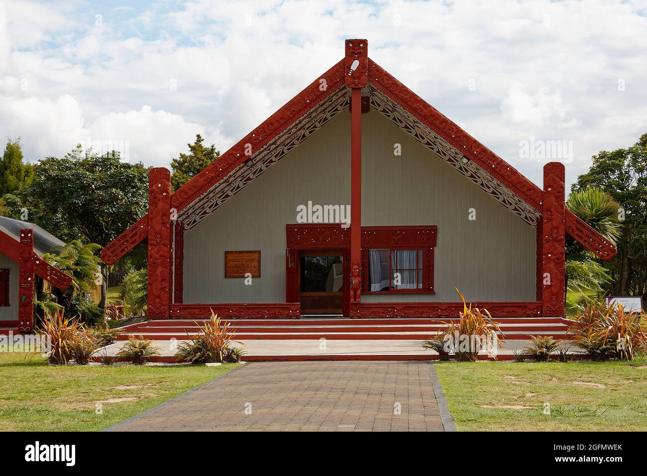 Maori Meeting House, wharenui, tekoteko on top, carved wood trim ...