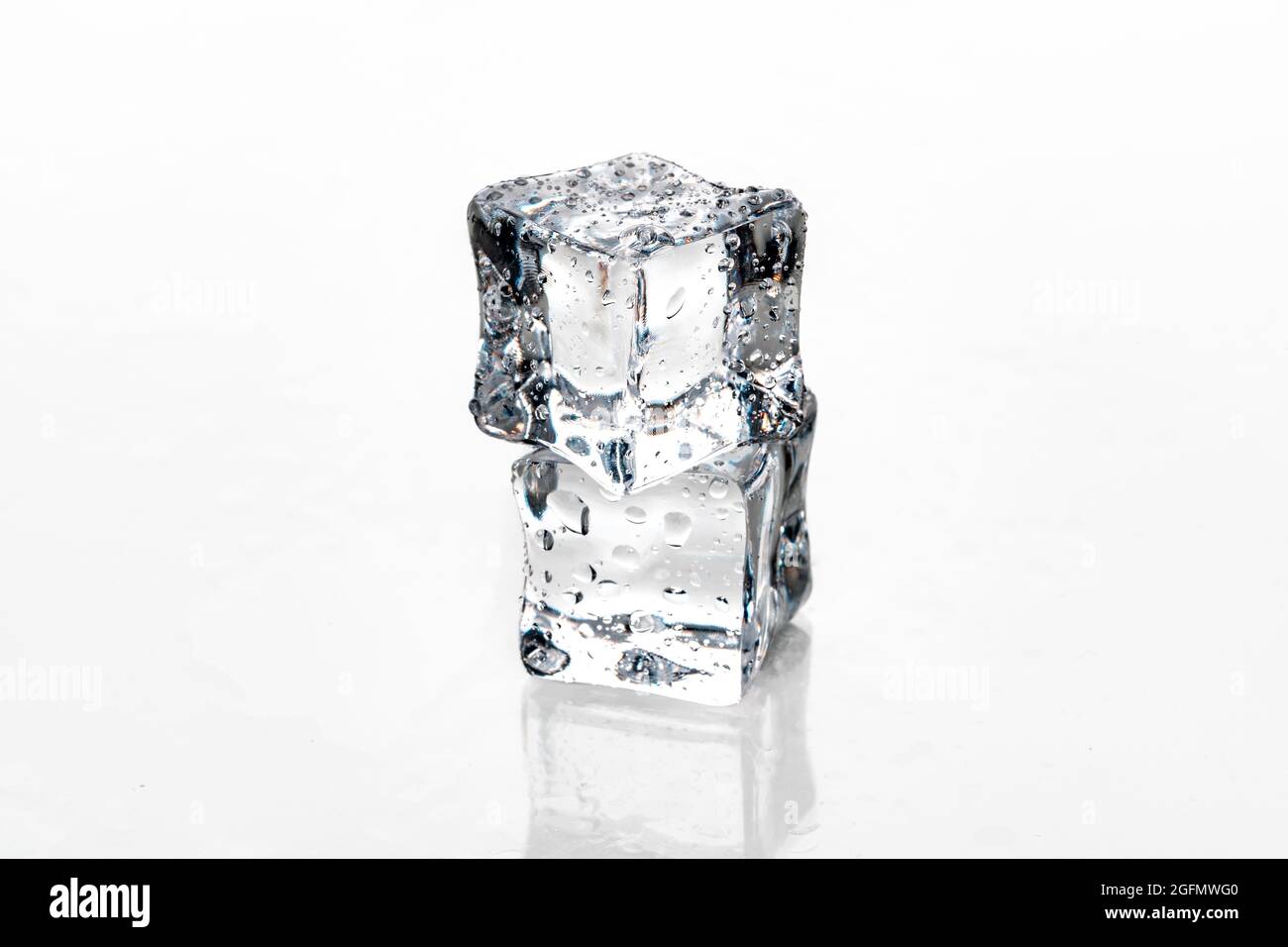 ice cubes on white background Stock Photo - Alamy