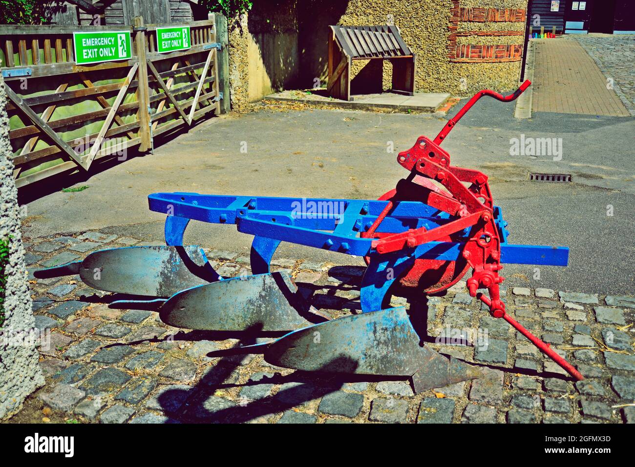 Painted farmer's plough on display Stock Photo - Alamy