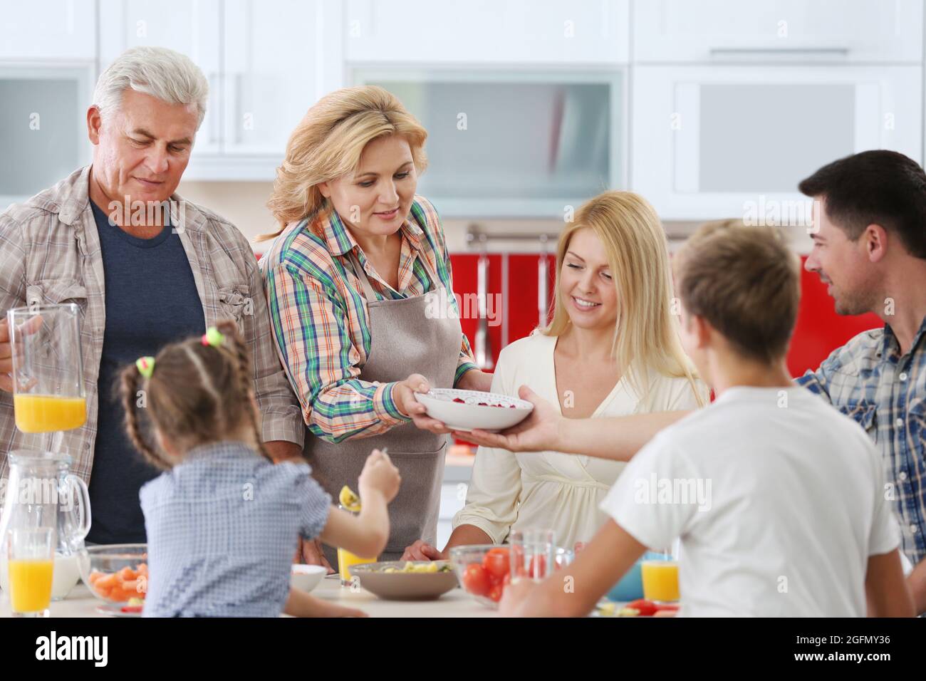 Happy large family on kitchen Stock Photo - Alamy
