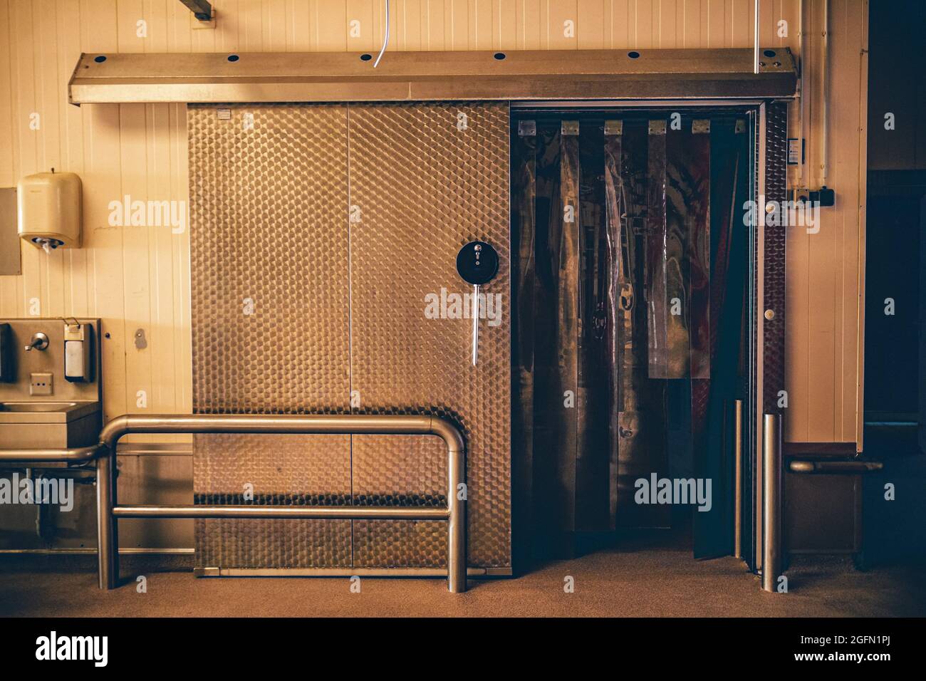 View of a brown metal shelves includes slaughtering tools inside a ...