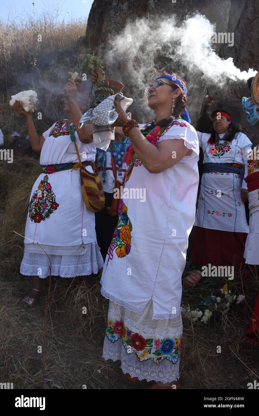 Curanderas—traditional healers or shamans—perform a ritual in front of ...