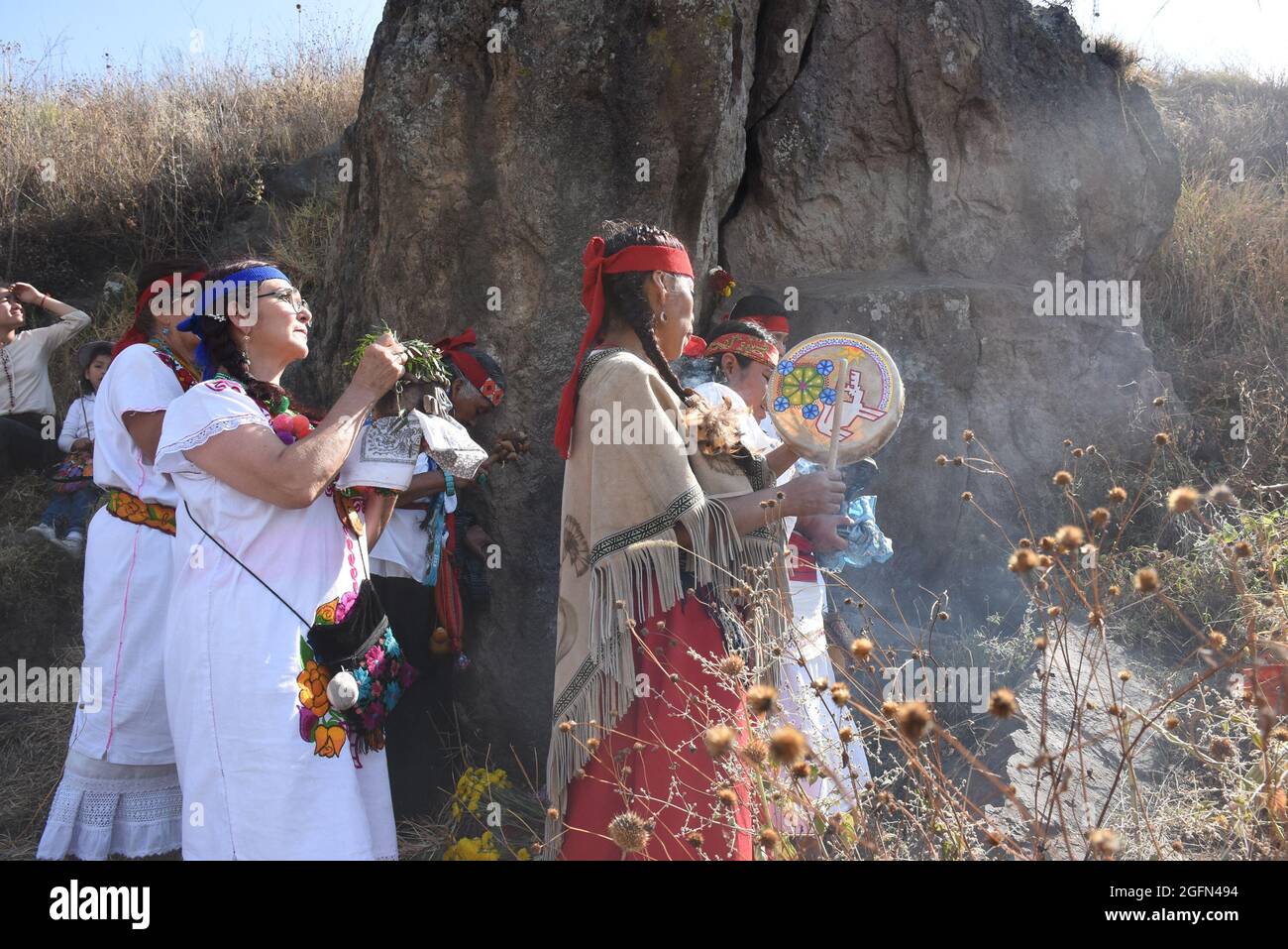 Curanderas—traditional healers or shamans—perform a ritual in front of ...
