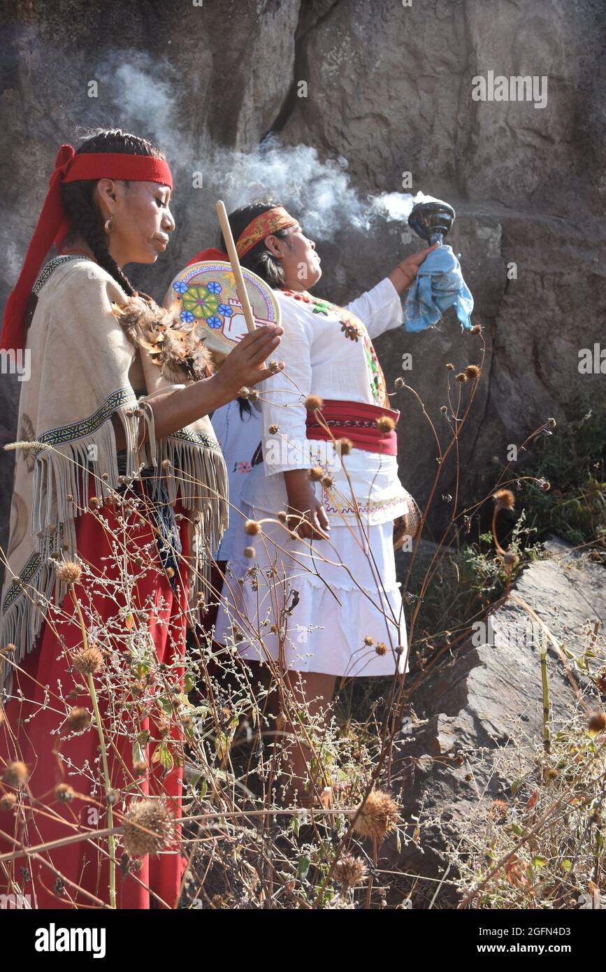 Curanderas—traditional healers or shamans—perform a ritual in front of ...