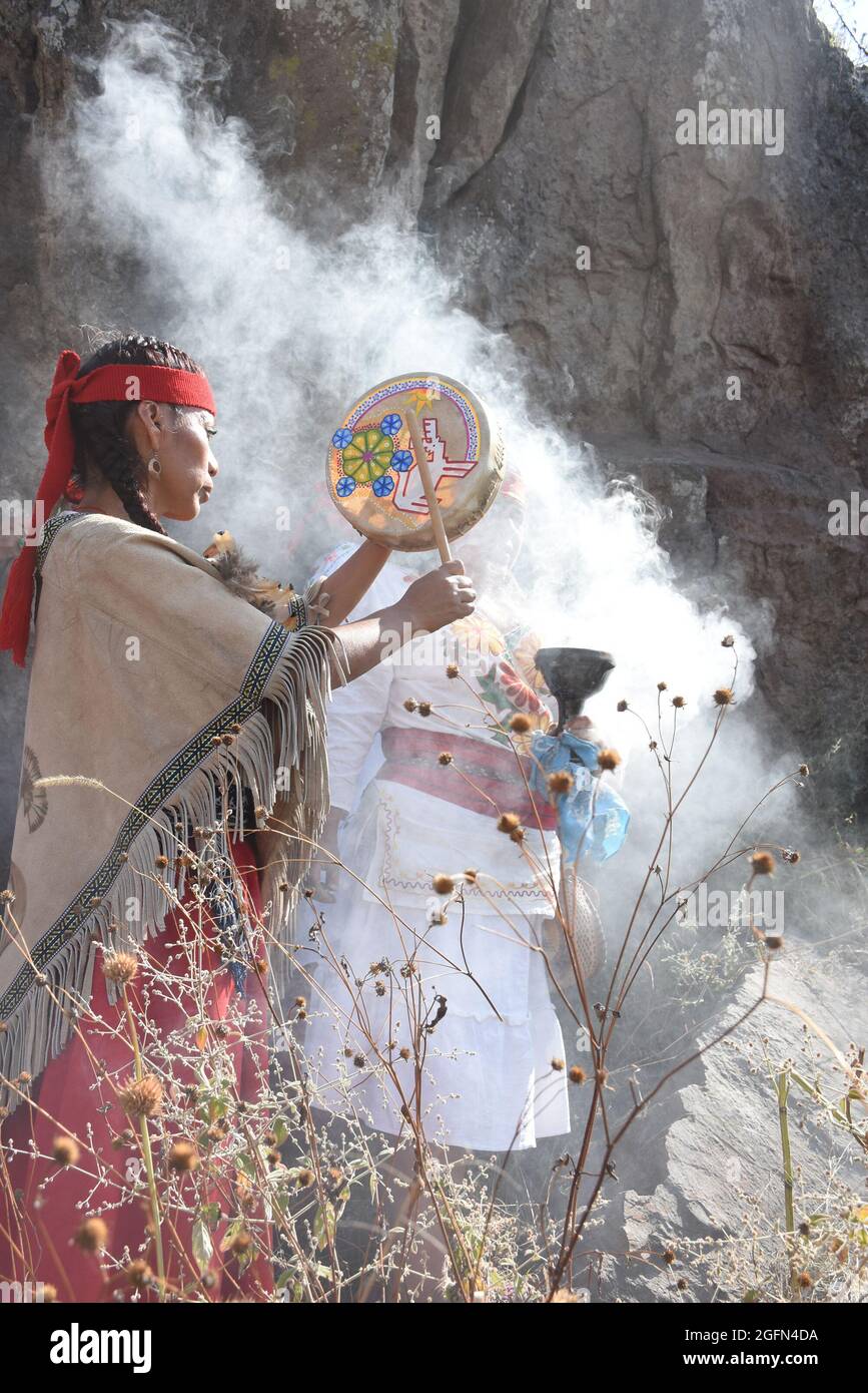 Curanderas—traditional healers or shamans—perform a ritual in front of ...