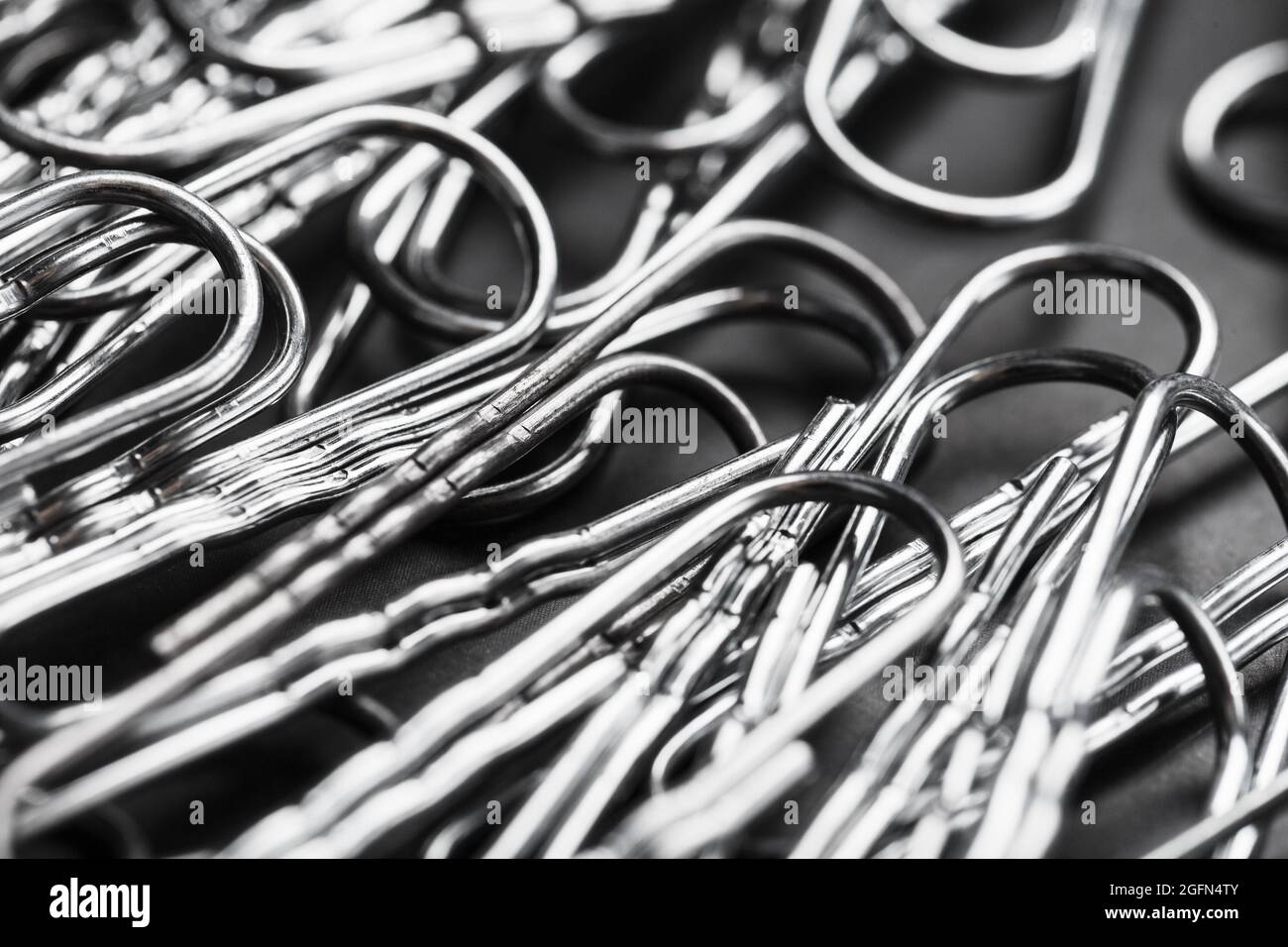 Silver paper clips textured background, full screen Stock Photo - Alamy