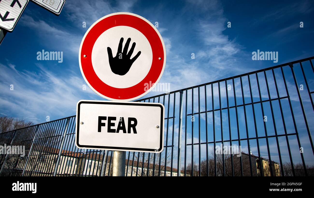 Street Sign the Direction Way to Courage versus Fear Stock Photo - Alamy