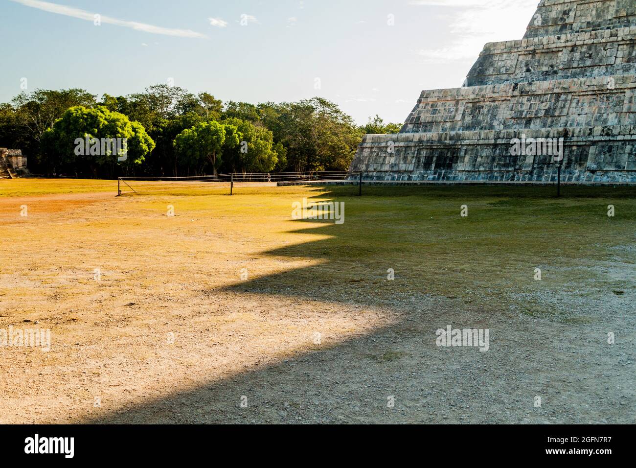 Early morning shadow of the pyramid Kukulkan in the Mayan archeological ...