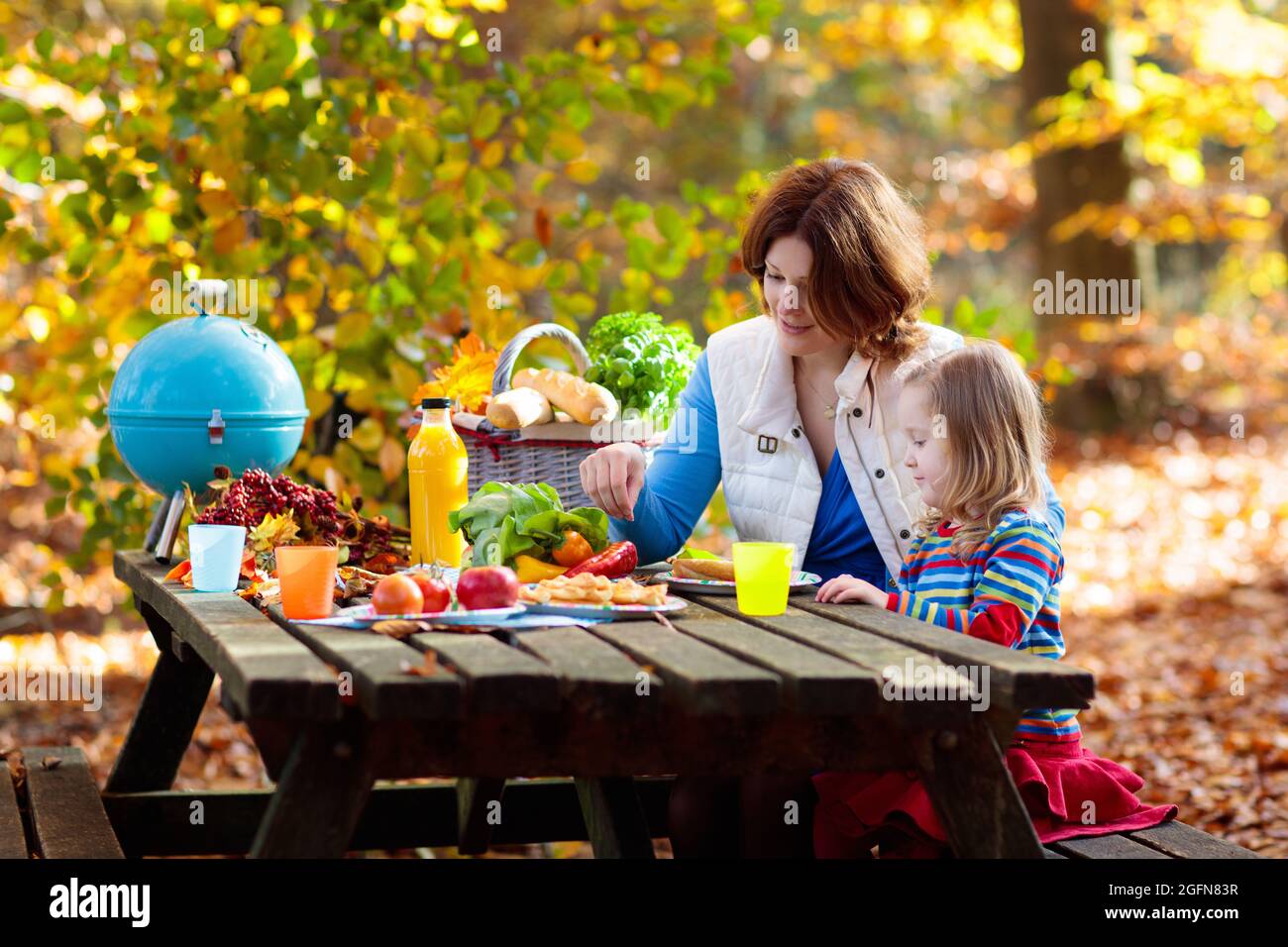 Picnic in autumn park. Family fall outdoor barbeque grill party ...