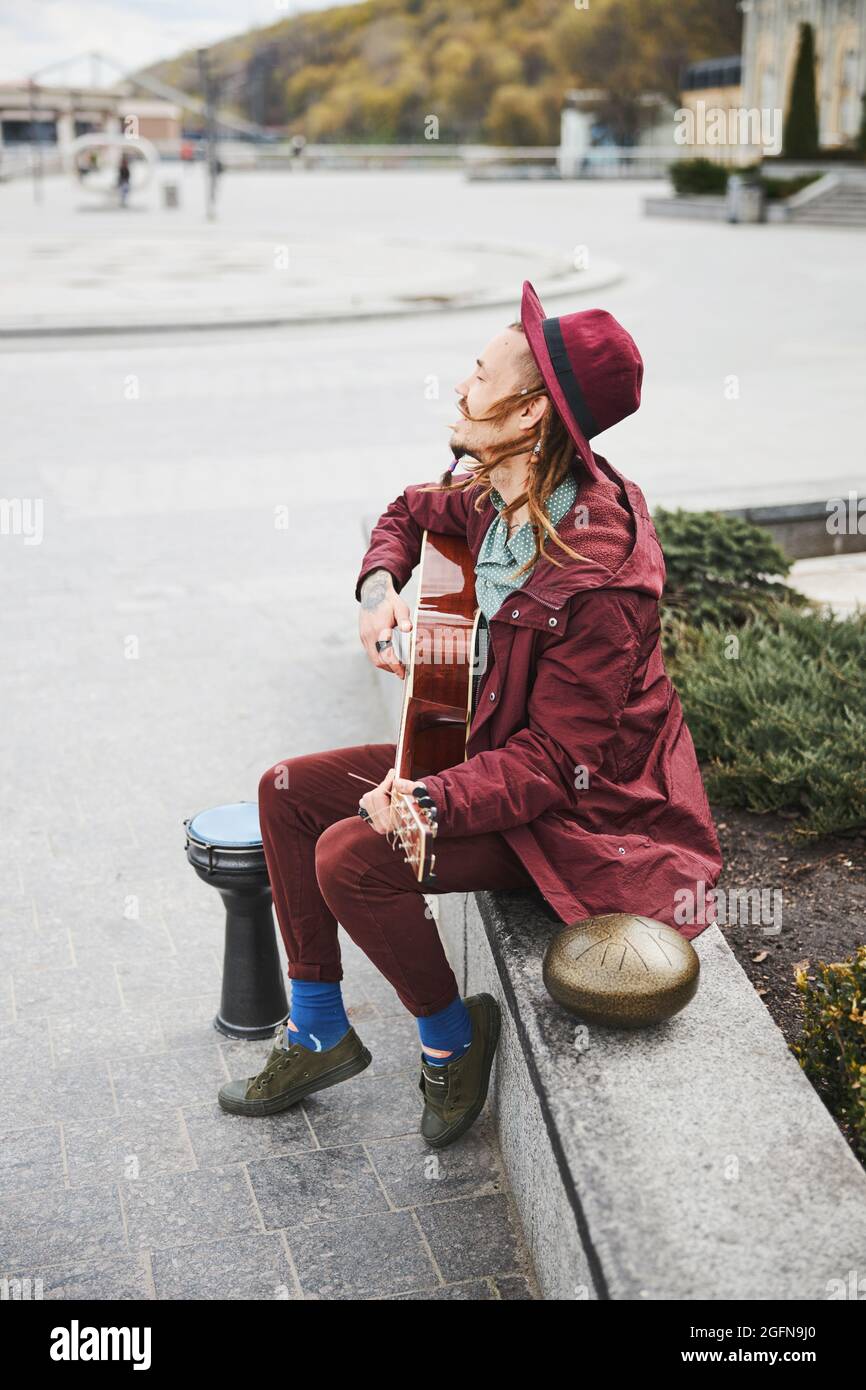 Happy performer making free concert on square Stock Photo - Alamy