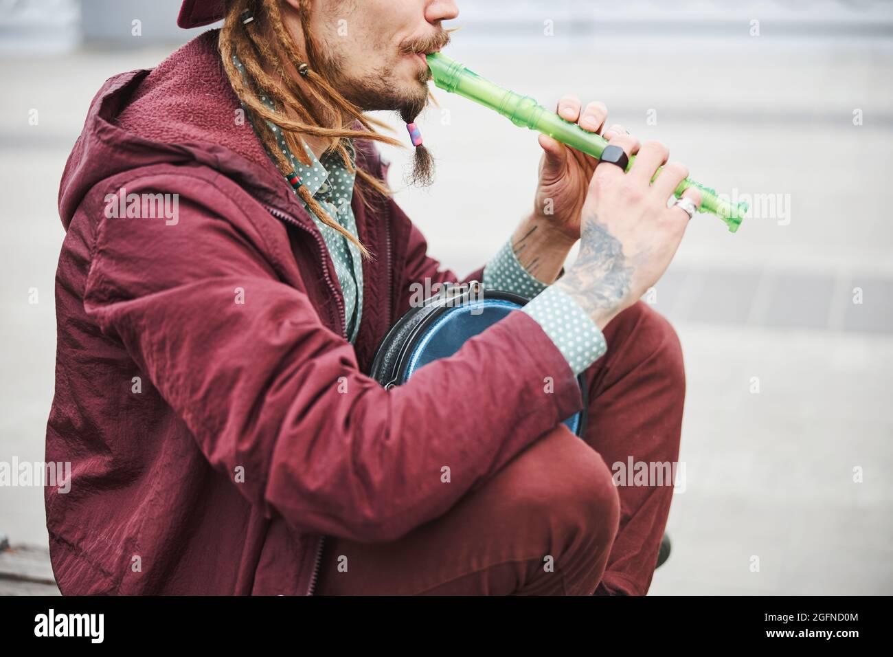 Man playing flute outside hi-res stock photography and images - Alamy