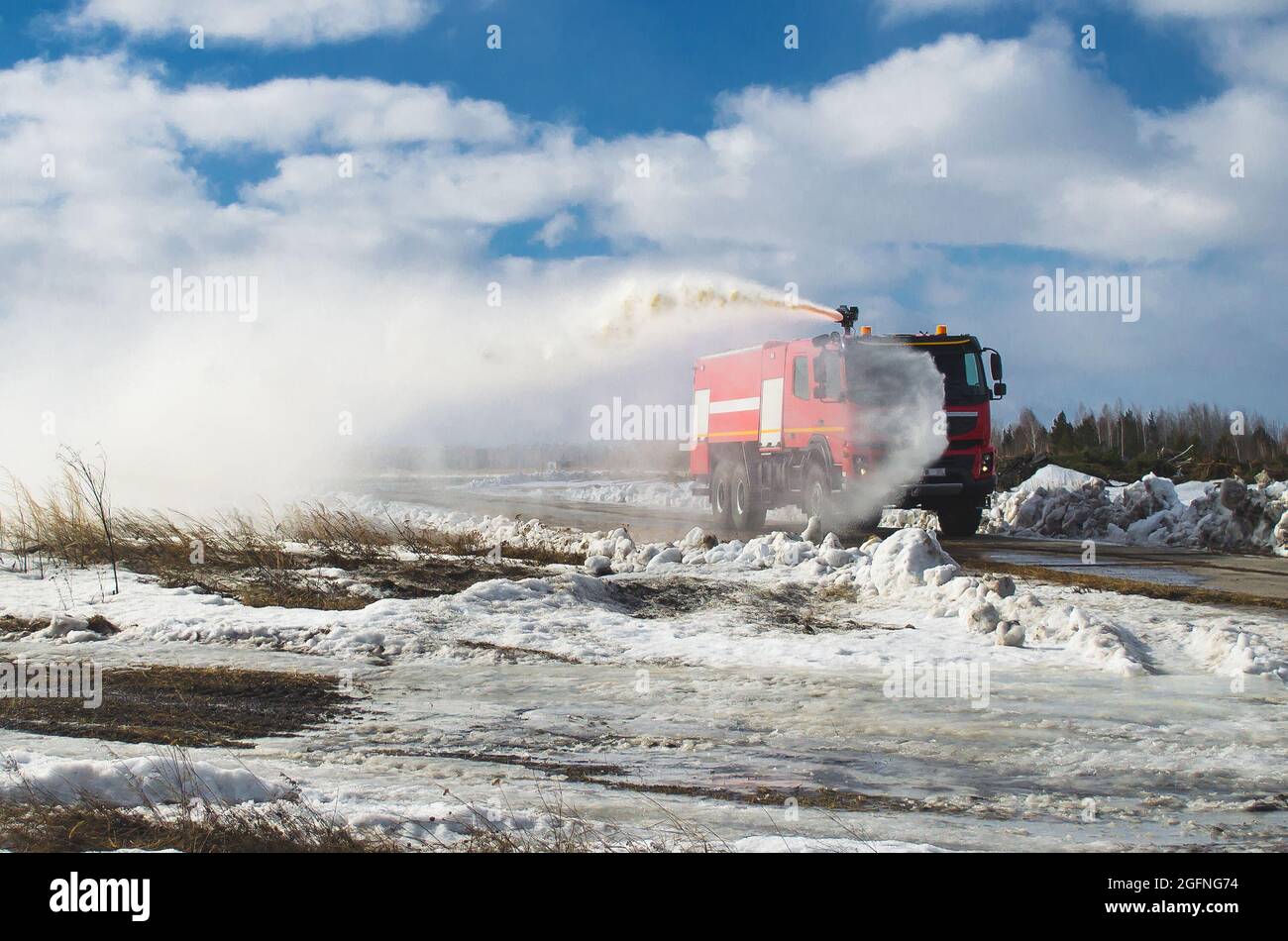Fire engine and water from fire hoses demonstration Stock Photo - Alamy