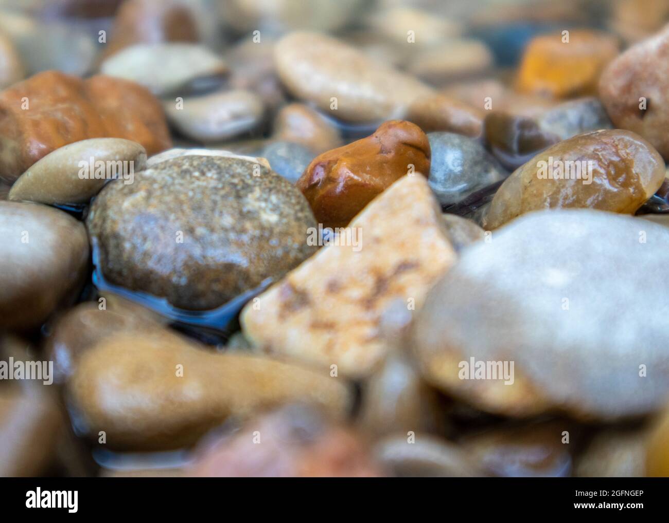 Rock covered in water Stock Photo - Alamy