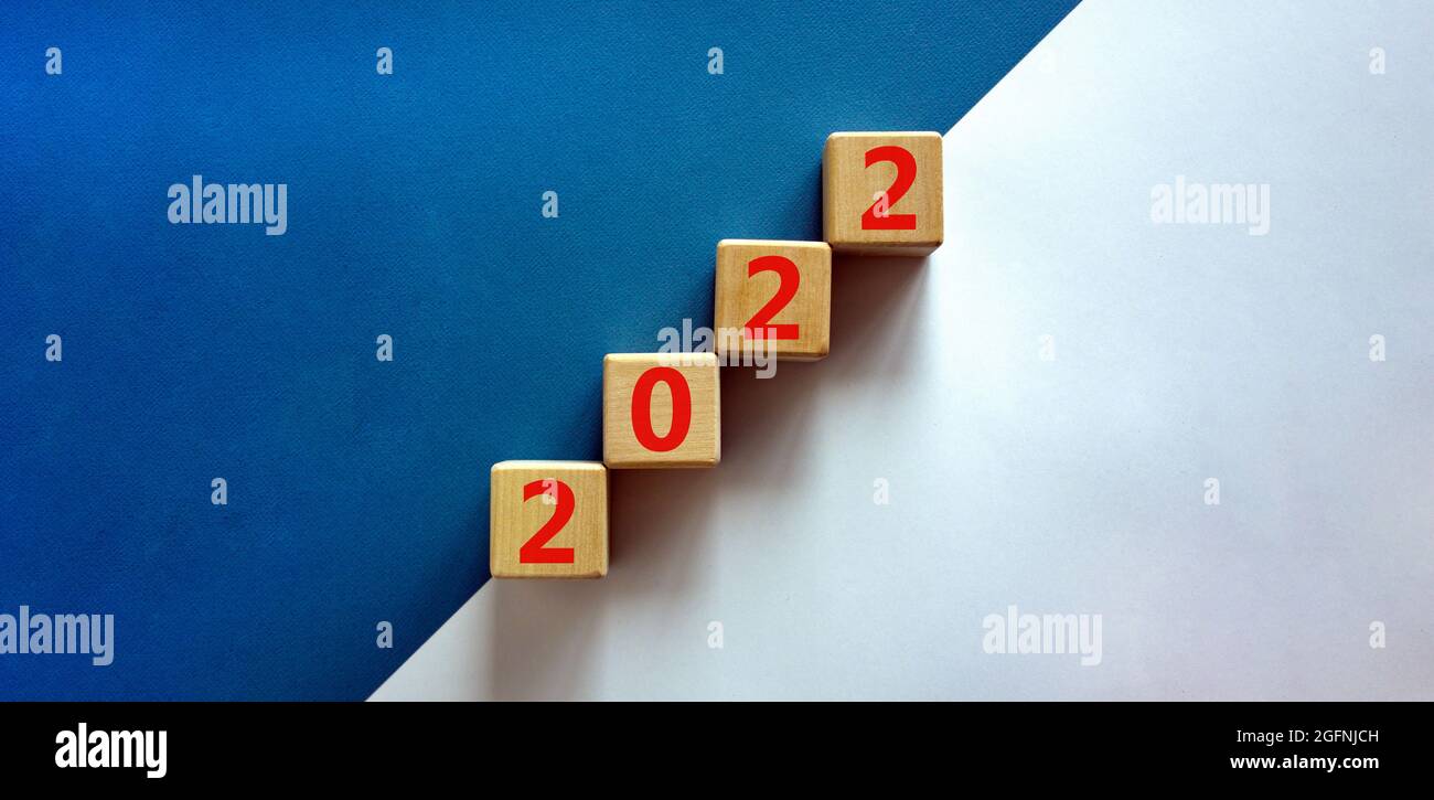 2022 happy new year symbol. Wooden cubes symbolize the change from 2021 ...