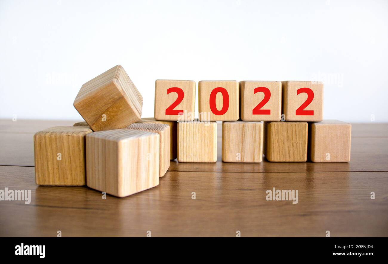 2022 happy new year symbol. Wooden cubes symbolize the change from 2021 ...