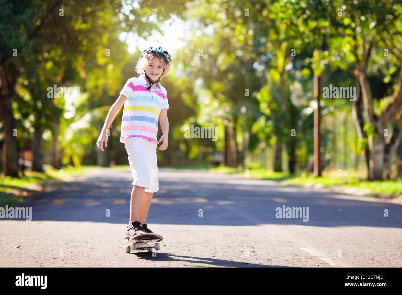 Kid with skateboard. Child riding skate board. Healthy sport and ...