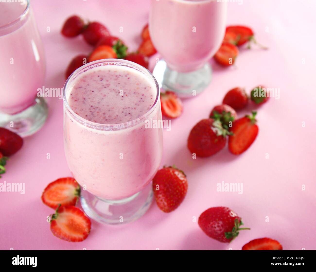 Strawberry milkshakes on color background Stock Photo - Alamy