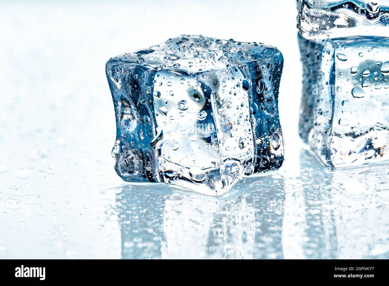 ice cubes on blue background Stock Photo - Alamy