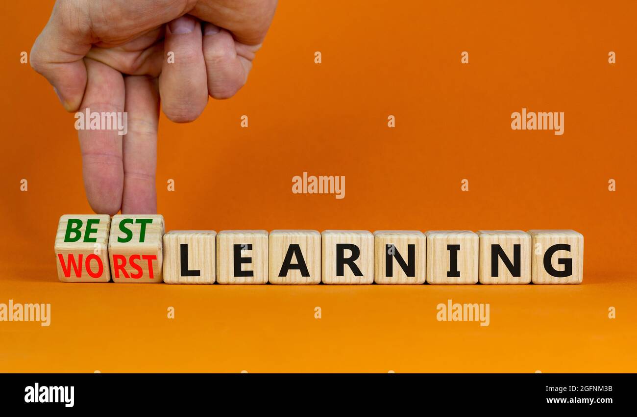 Best or worst learning symbol. Businessman turns cubes, changes words ...