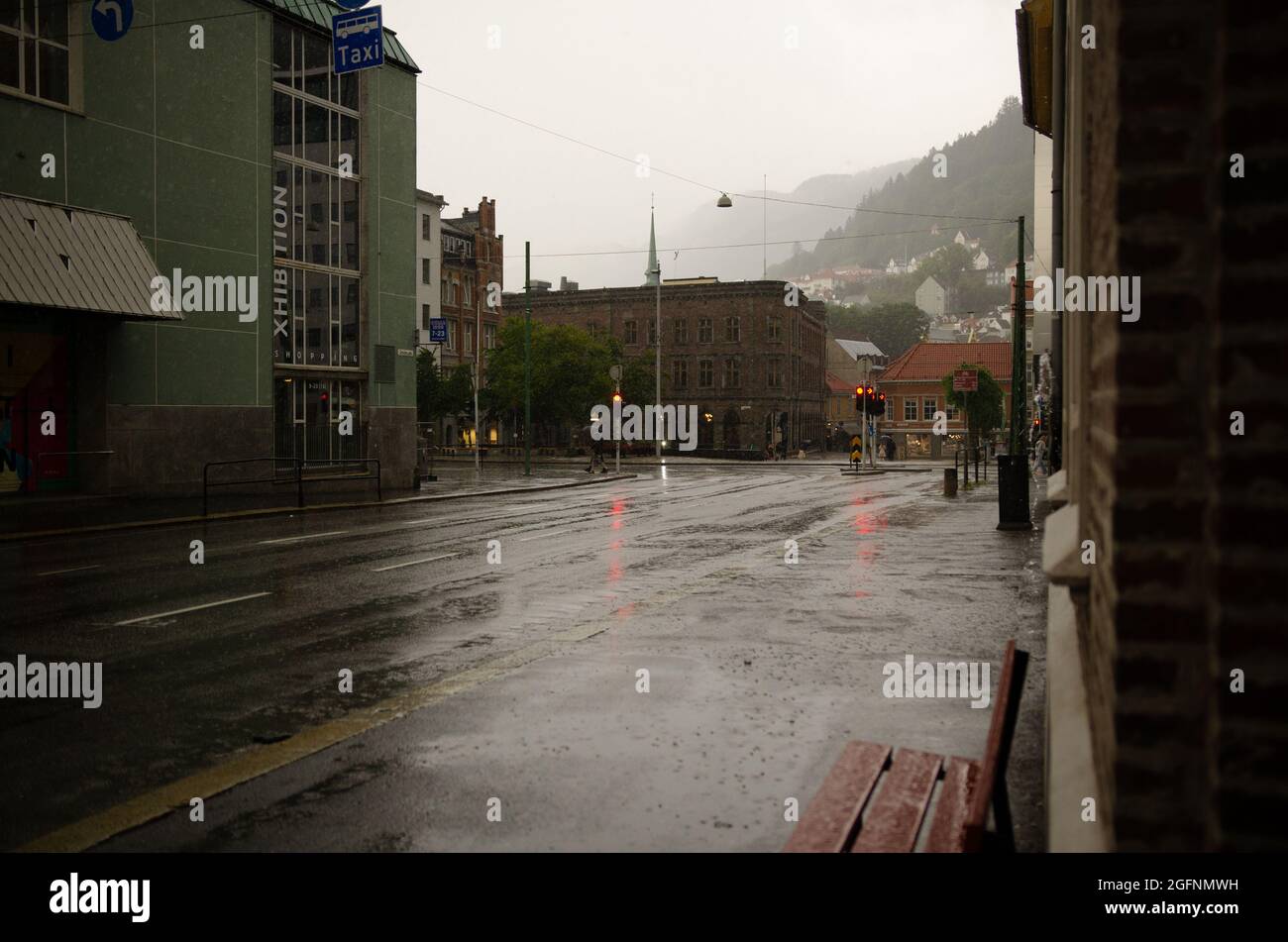 Empty and wet street in the city during rainy day Stock Photo - Alamy