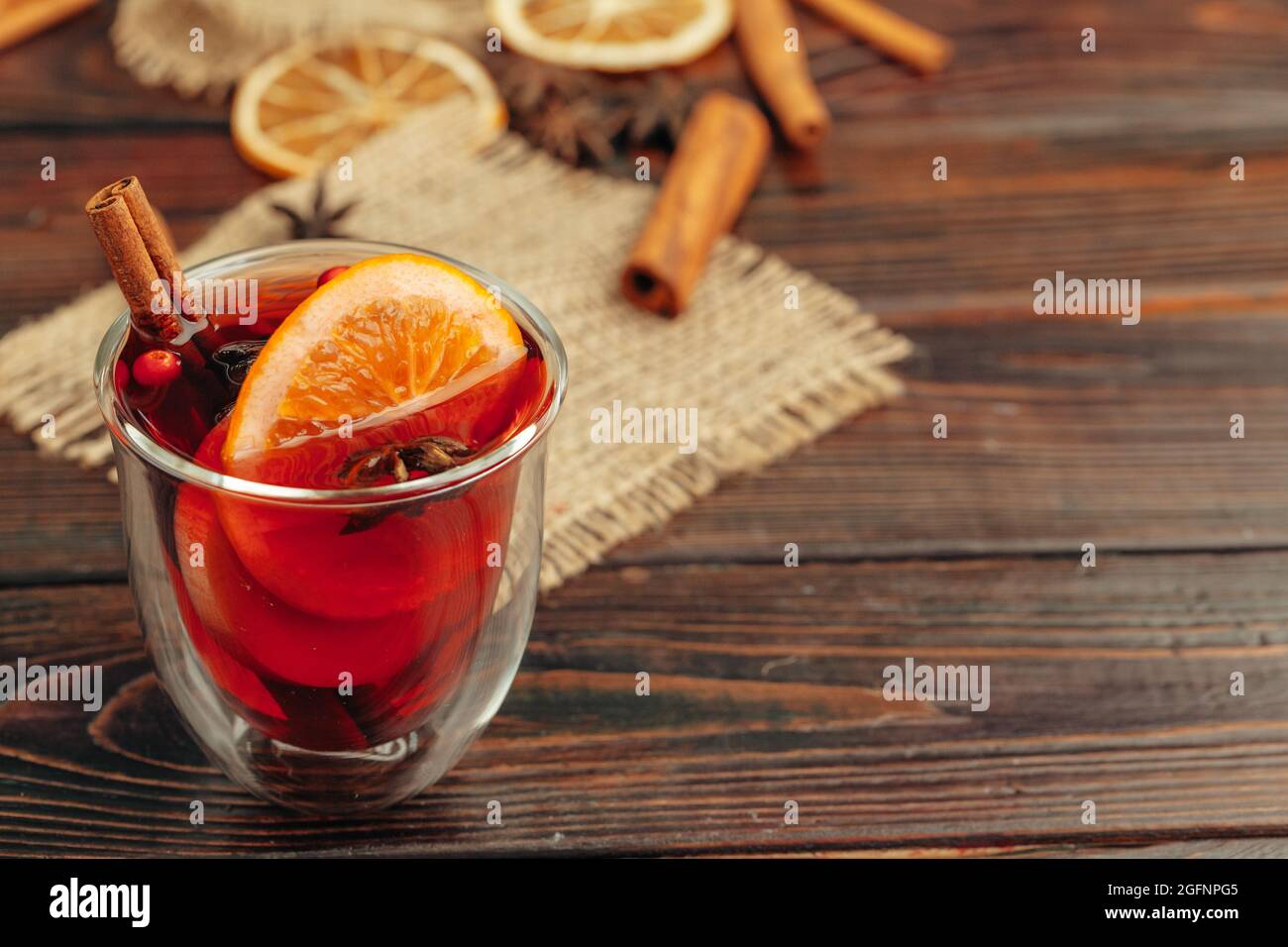 Close up of mulled wine cup with spices and berries on grey table Stock ...