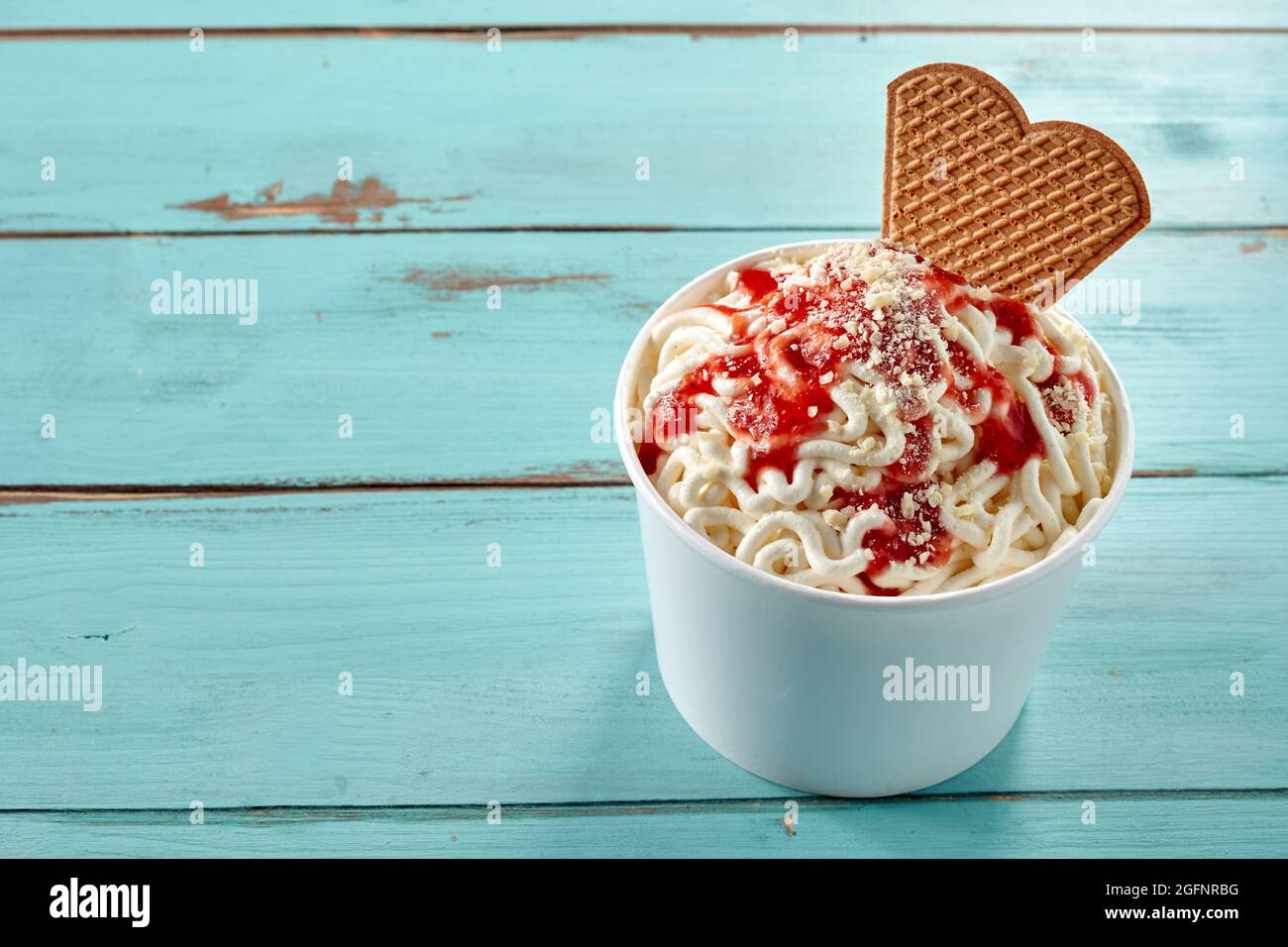 Creamy German vanilla spaghetti ice-cream summer dessert topped with ...