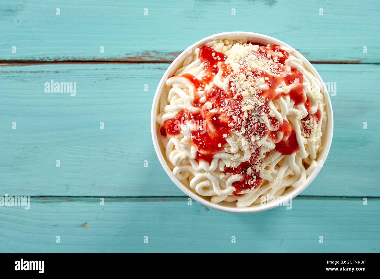 Serving of speciality German vanilla spaghetti ice-cream sundae in a ...