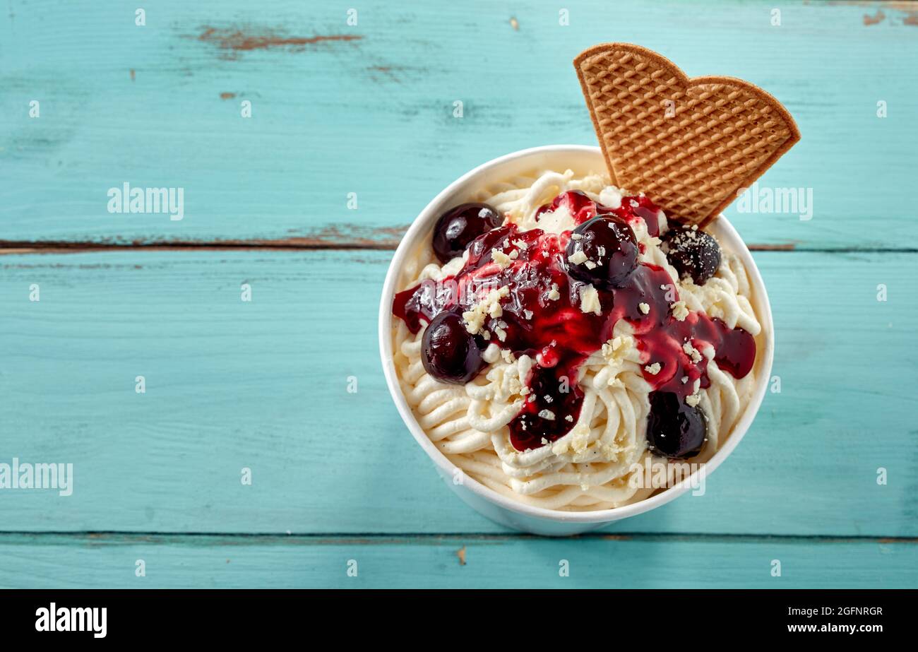 Gourmet German summer dessert with vanilla spaghetti ice-cream topped ...