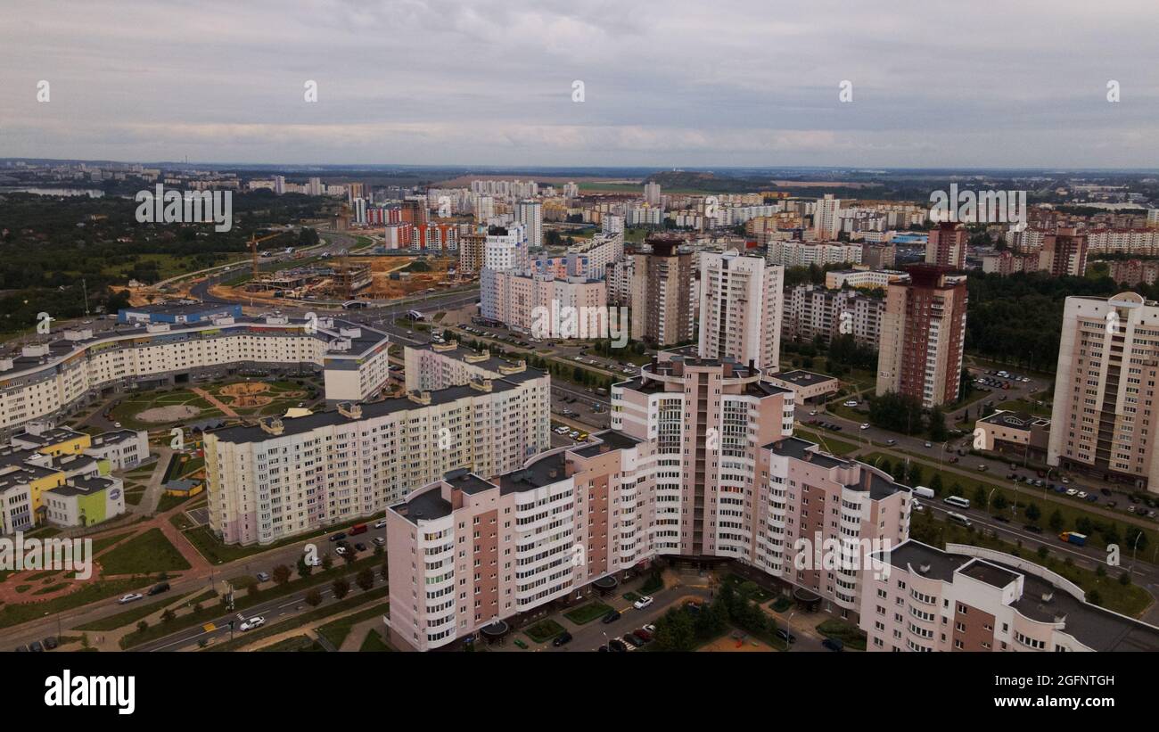 City block. Modern multi-storey buildings. Flying at dusk at sunset ...