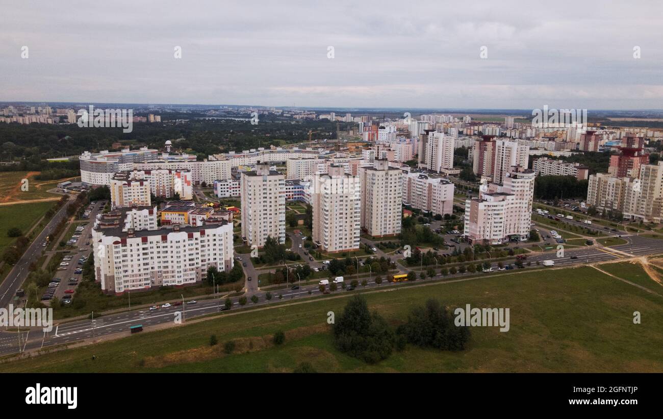 City block. Modern multi-storey buildings. Flying at dusk at sunset ...