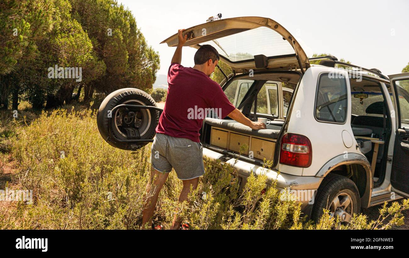 Man closing trunk vehicle hi-res stock photography and images - Alamy