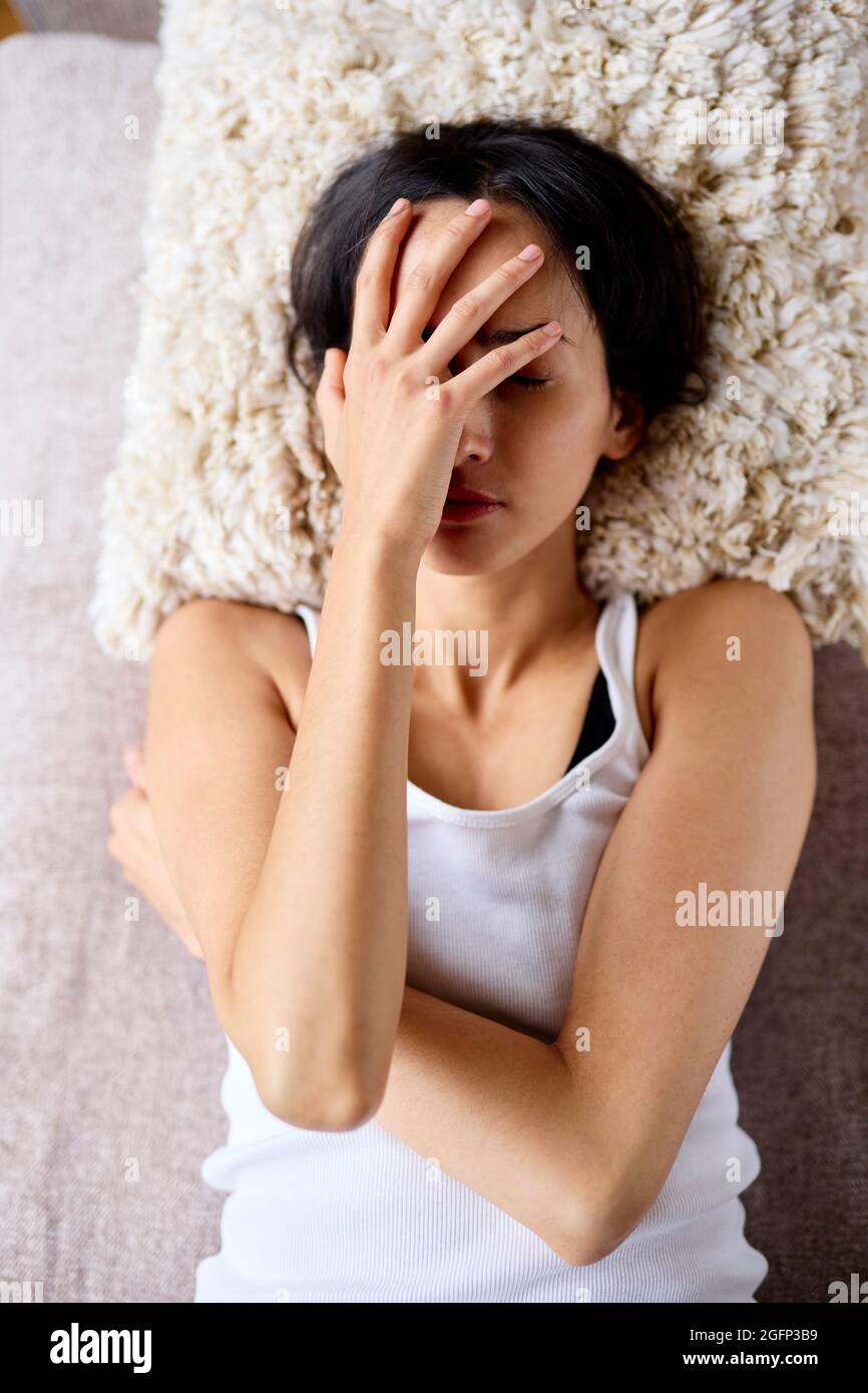 Girl with hands over her face Stock Photo - Alamy