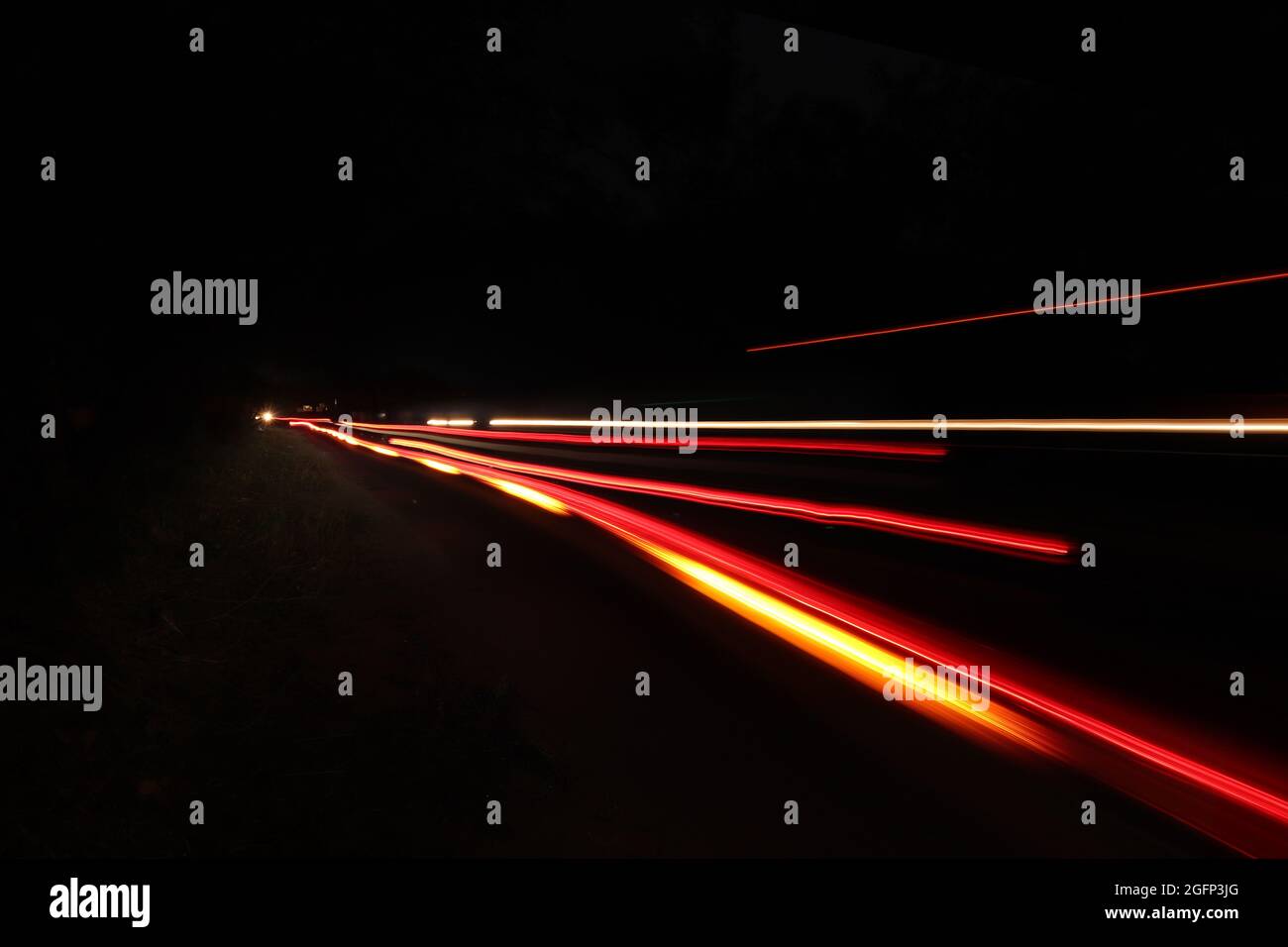 Time-lapse shot of the red car lights in motion on the highway at night ...