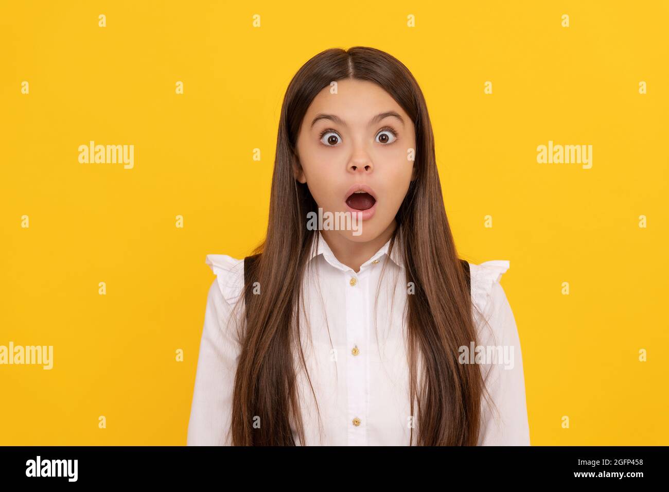 amazed child face portrait in school uniform expressing emotions ...