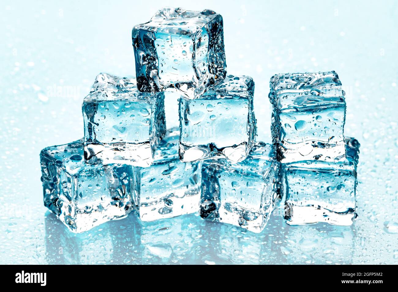 ice cubes on blue background Stock Photo - Alamy