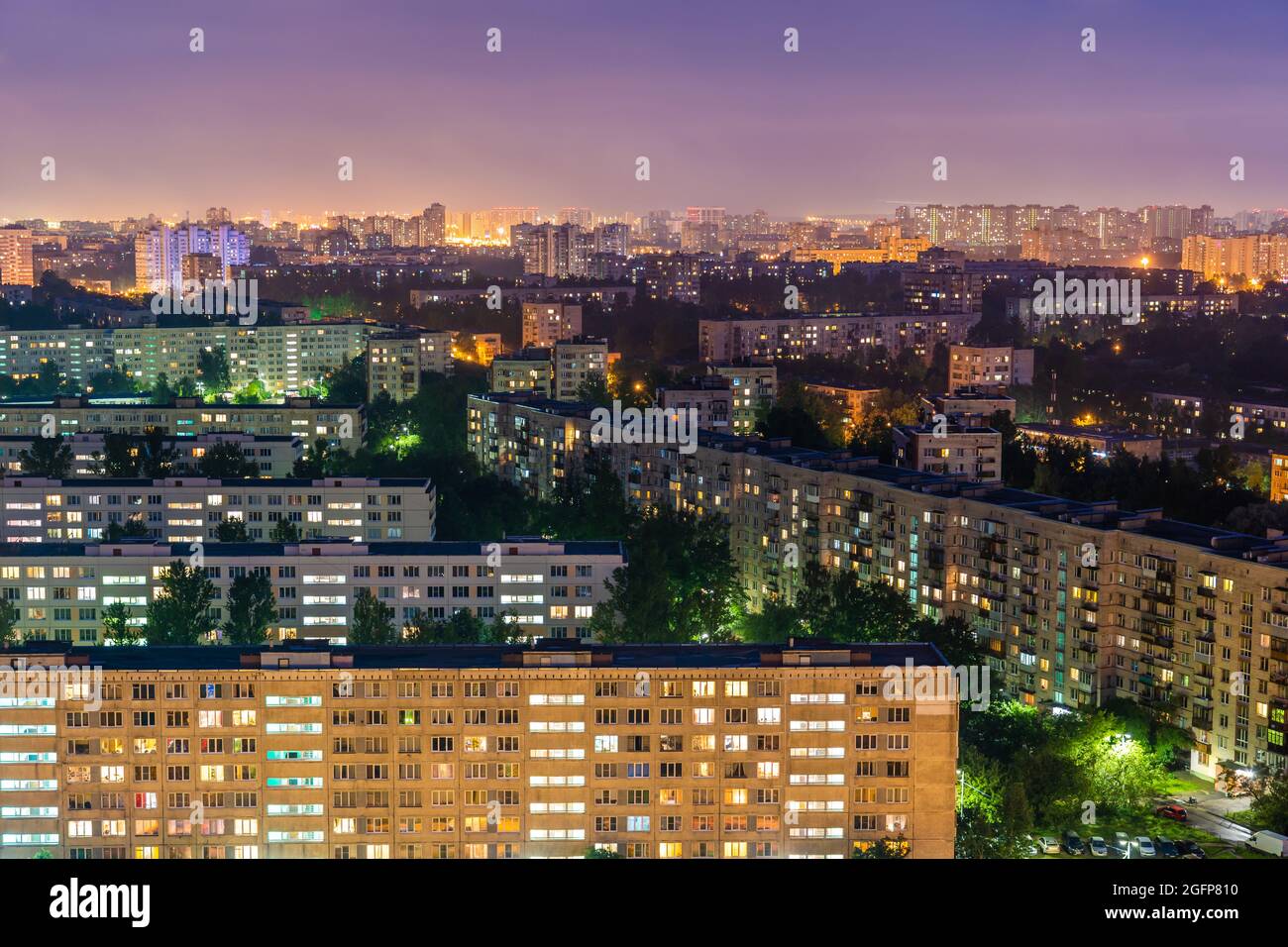 Night colorful windows lights of the high-rise residential building in ...