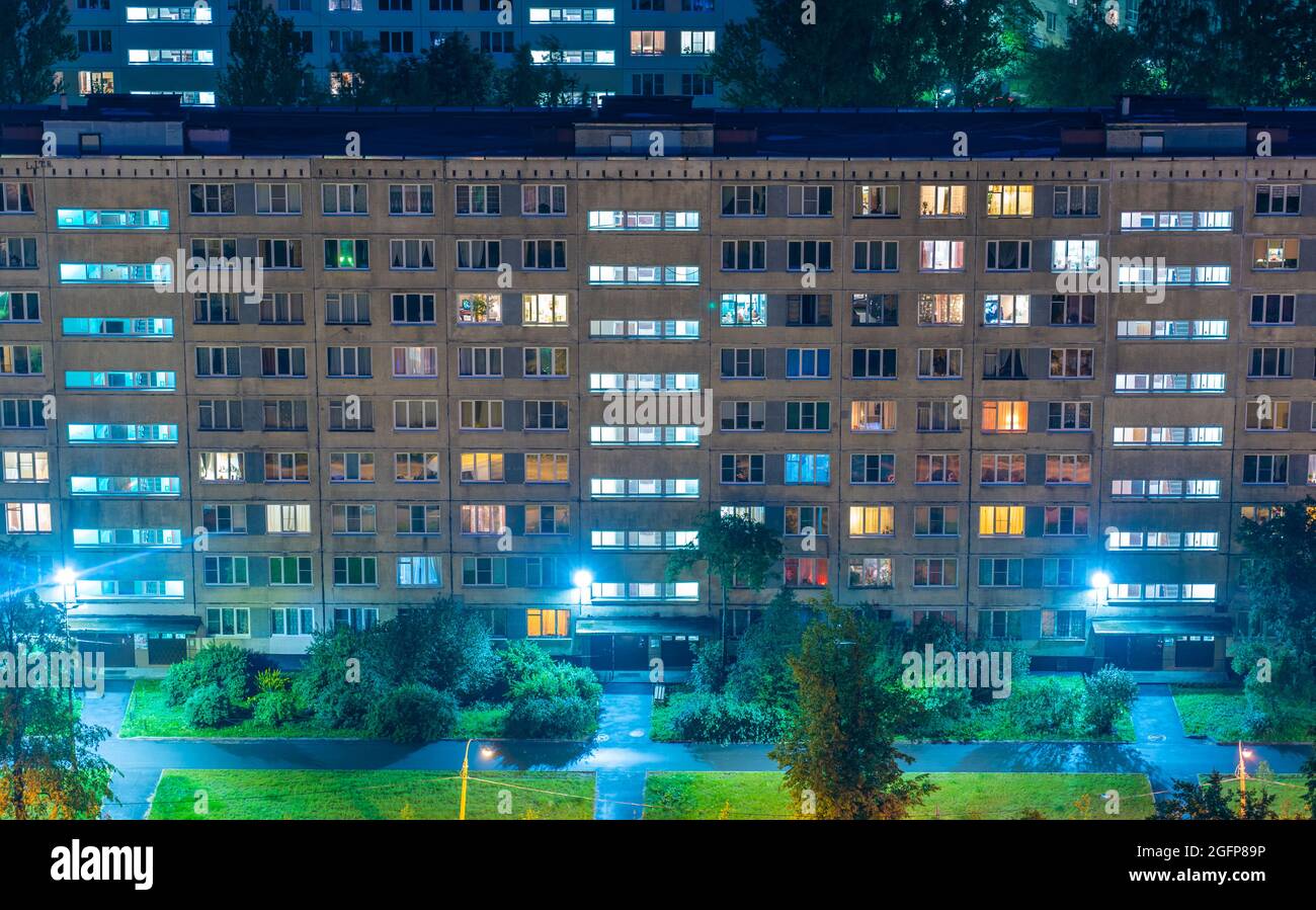 Night colorful windows lights of the high-rise residential building in ...