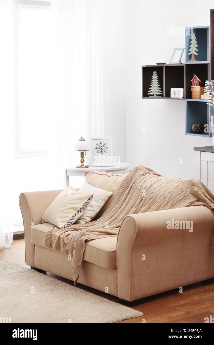 Beautiful interior with couch, shelf and window Stock Photo - Alamy