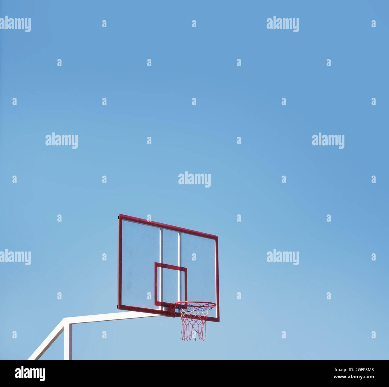 Basketball hoop on a clean blue sky. Sports Stock Photo - Alamy