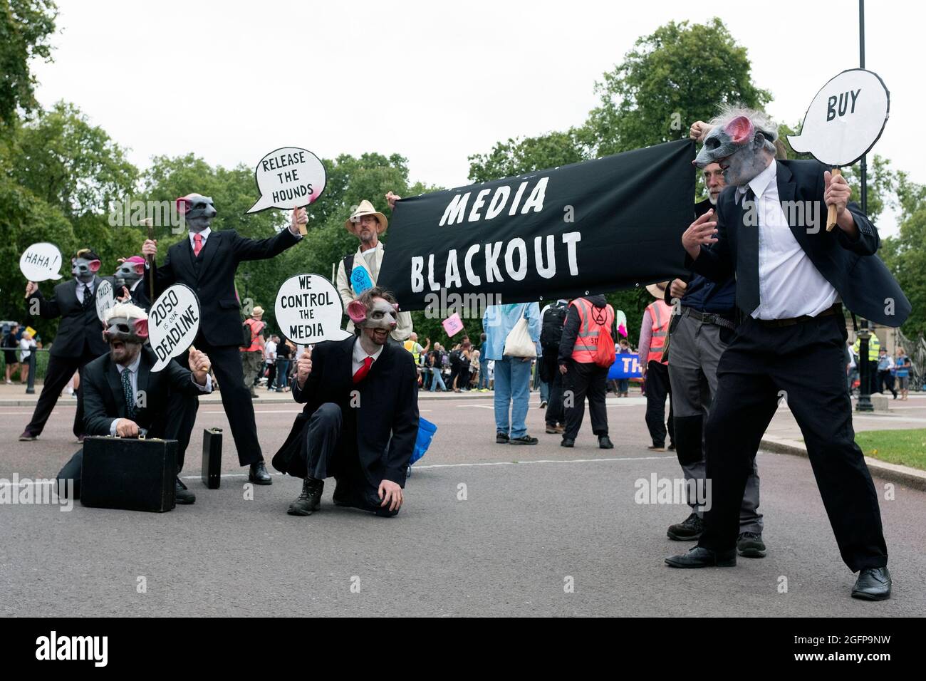 Men wearing rat masks pictured taunting Extinction Rebellion protestors ...