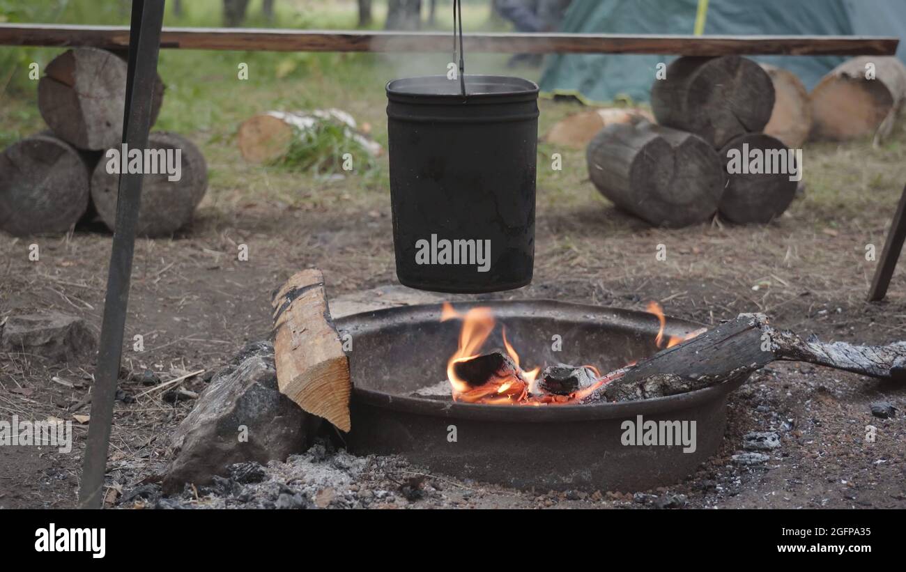 Pots cooking food on campfire hi-res stock photography and images - Alamy